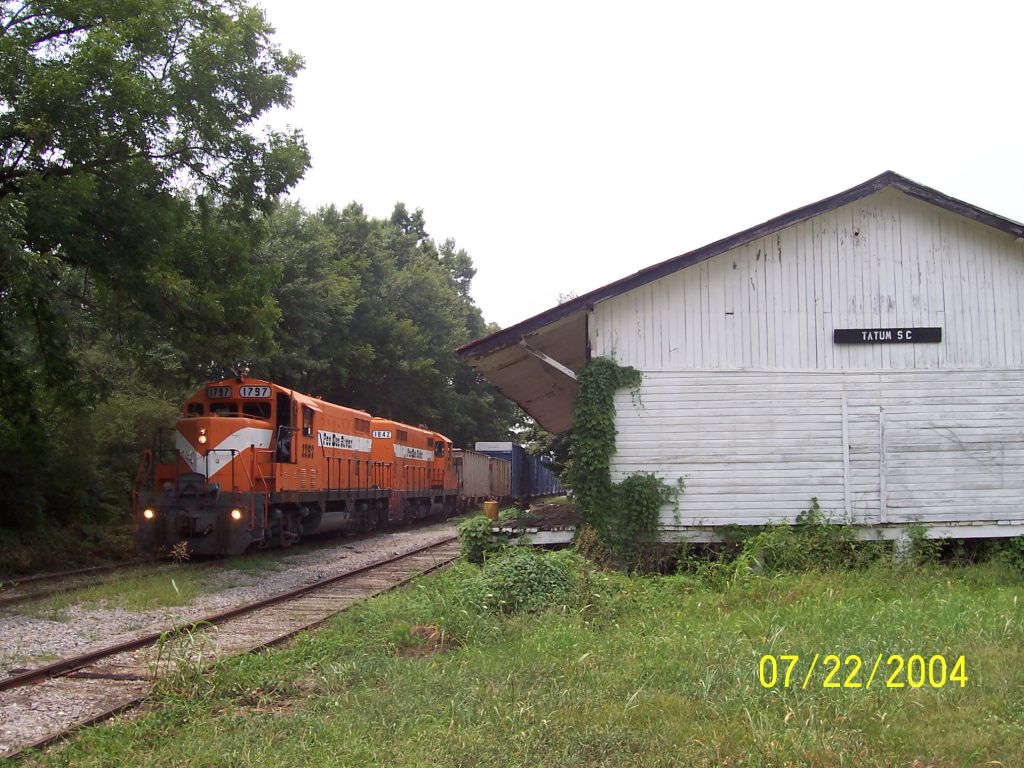 PDRR train passes old station house